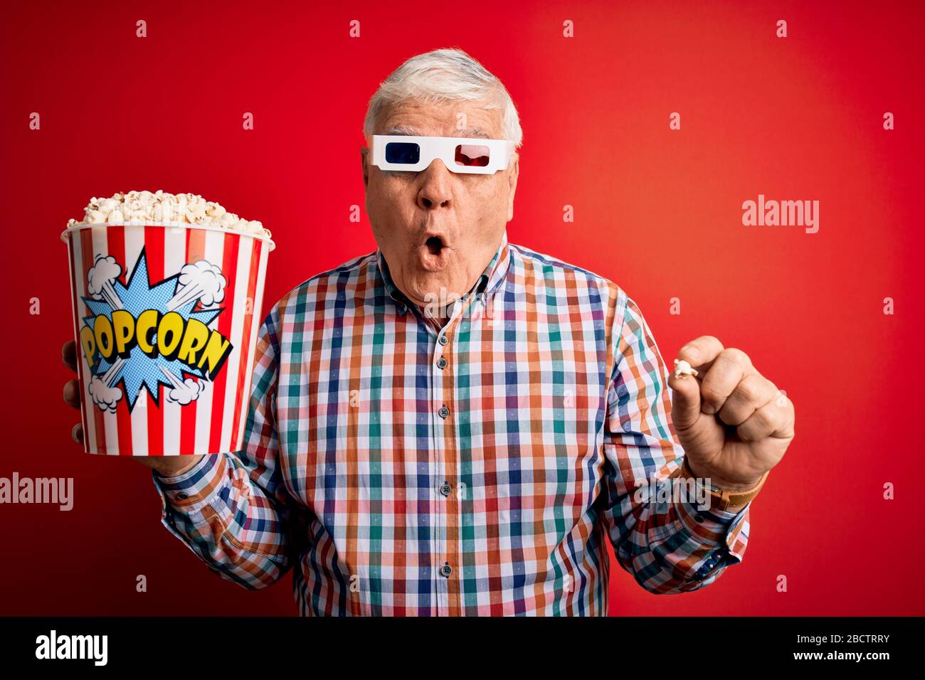 Sad man eating popcorn watching hi-res stock photography and images - Alamy