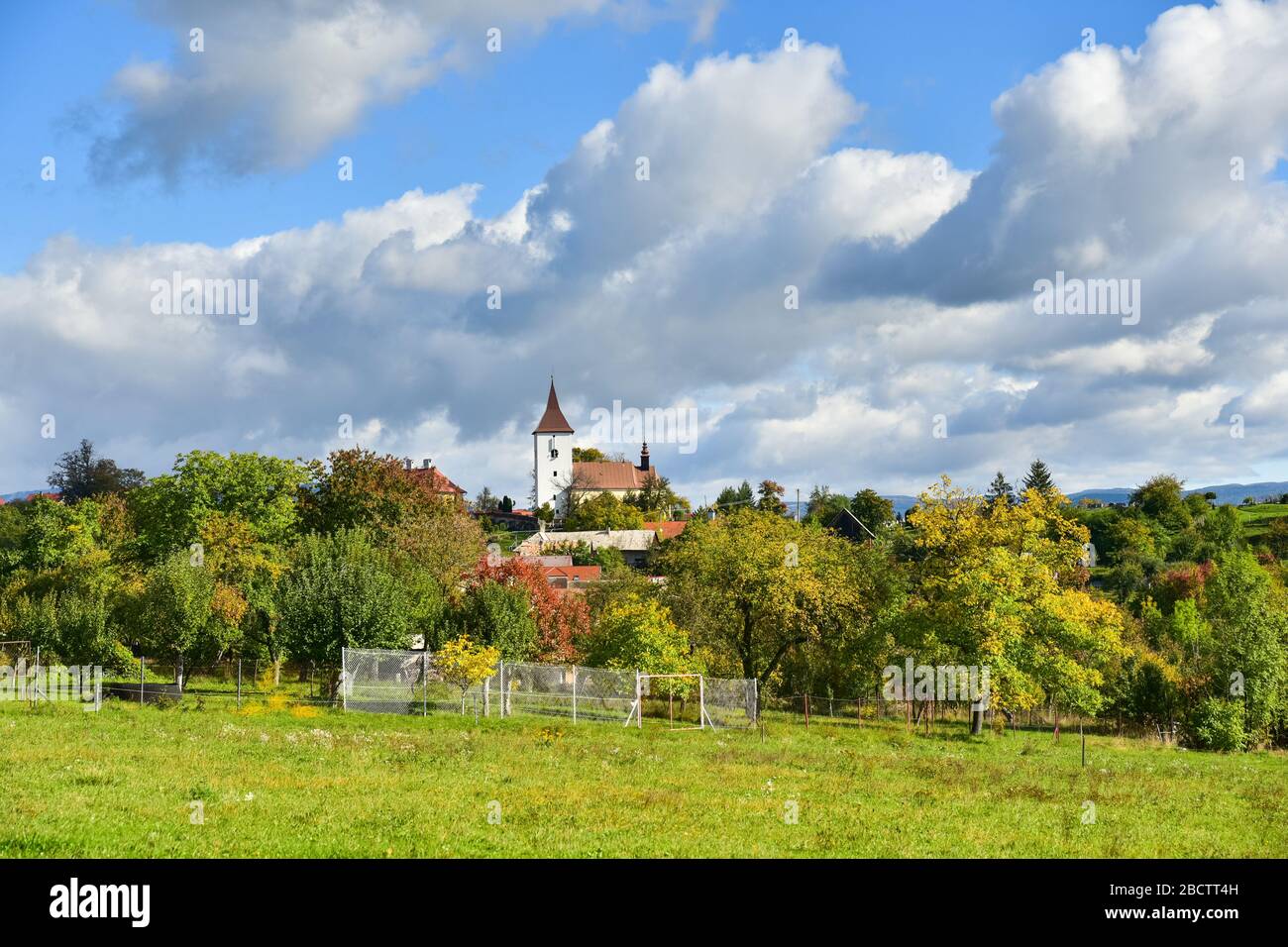 Church and village in rural landscape Stock Photo - Alamy