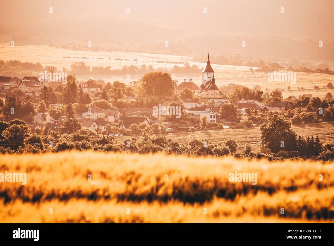 Beautiful spring rural landscape, yellow agricultural field, church and ...
