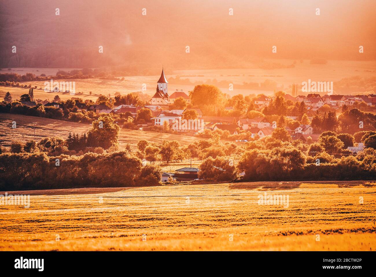 Beautiful spring rural landscape, yellow agricultural field, church and ...