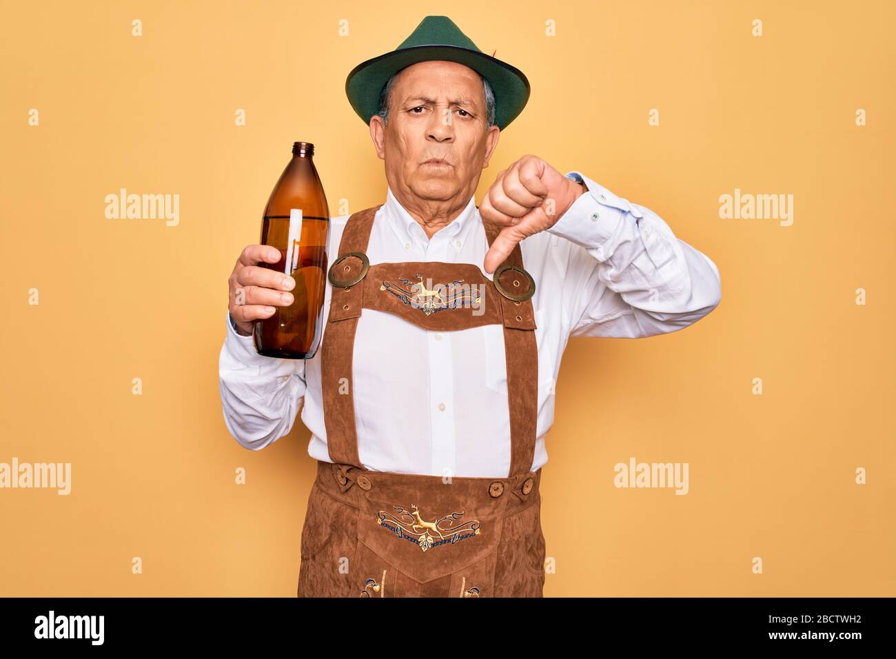 Senior grey-haired man wearing german traditional octoberfest suit ...