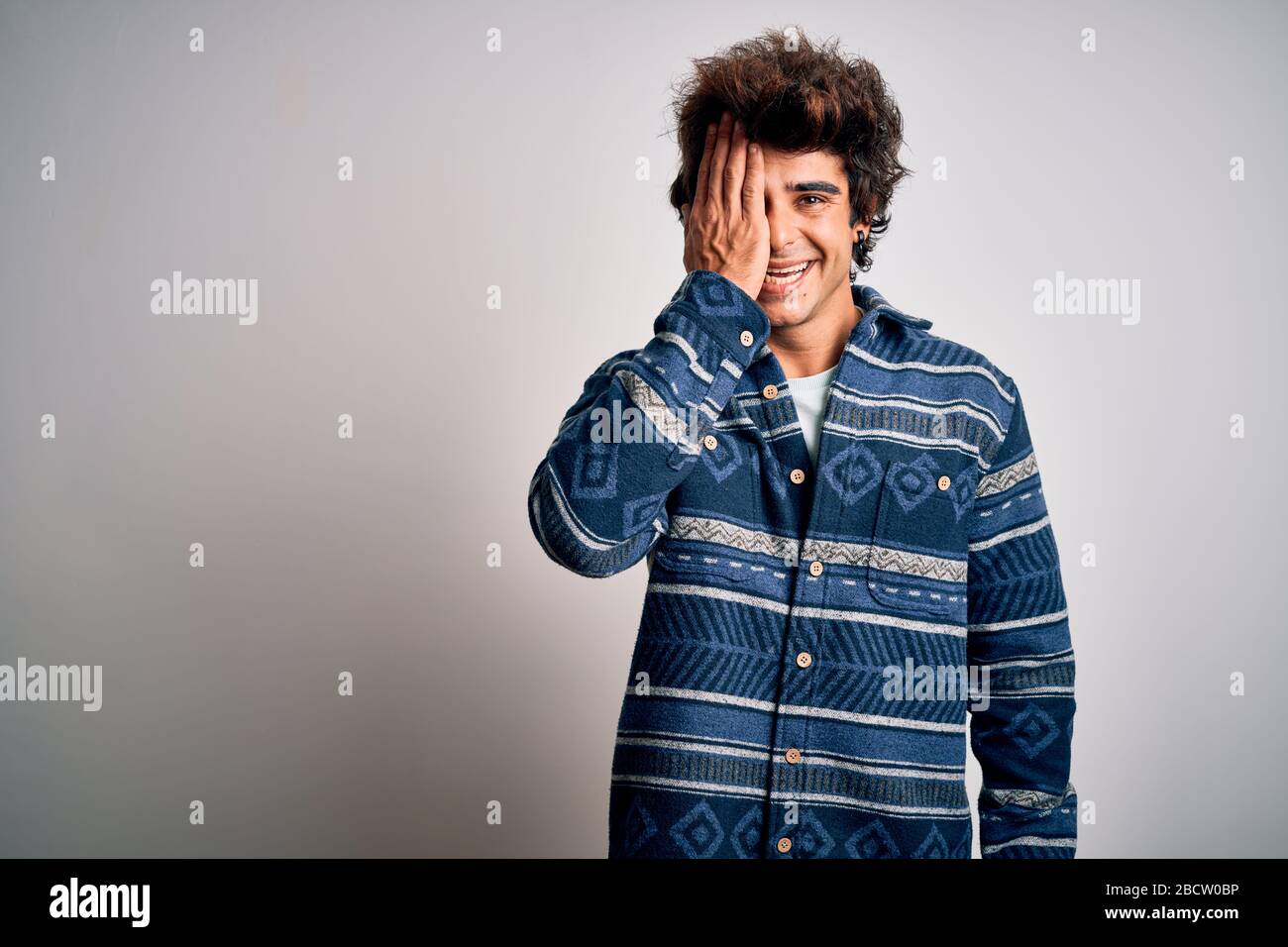 Young handsome man wearing casual shirt standing over isolated white ...