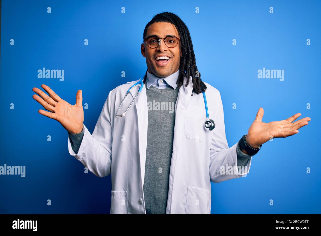 Young african american doctor man with dreadlocks wearing stethoscope ...