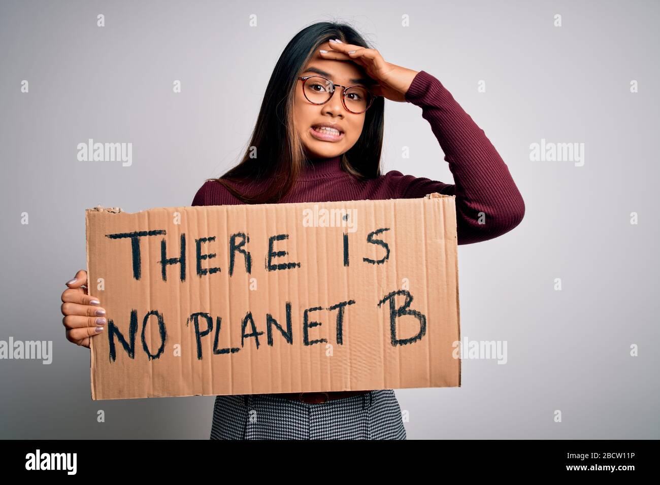 Young asian activist girl asking for environment holding banner with ...