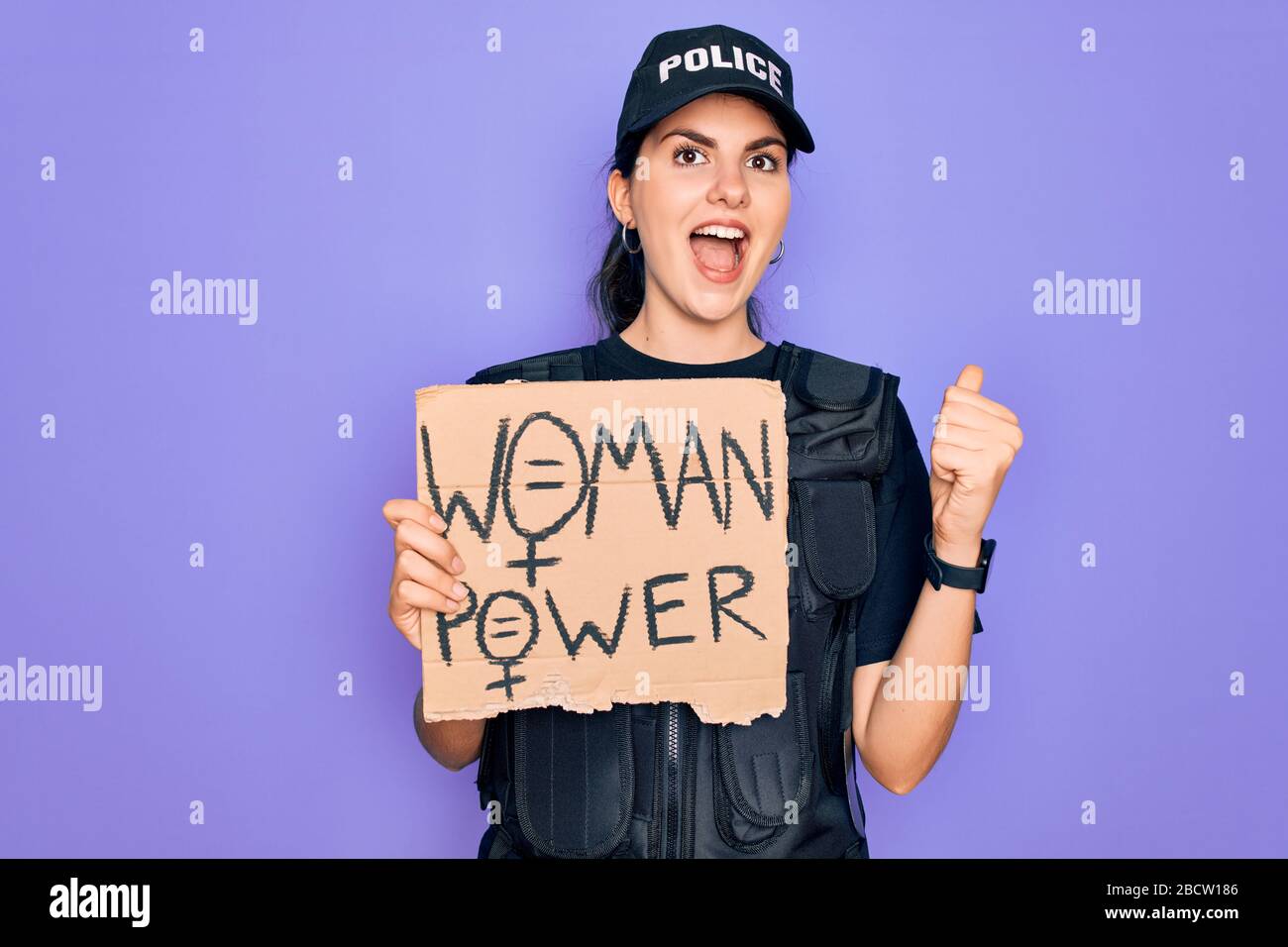 Police woman wearing security bulletproof vest uniform holding woman ...