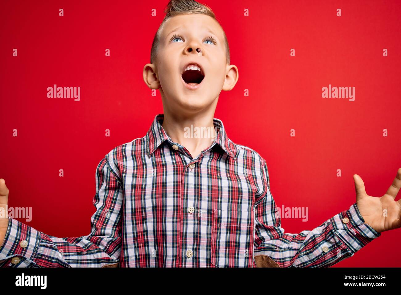 Young little caucasian kid with blue eyes standing wearing elegant ...