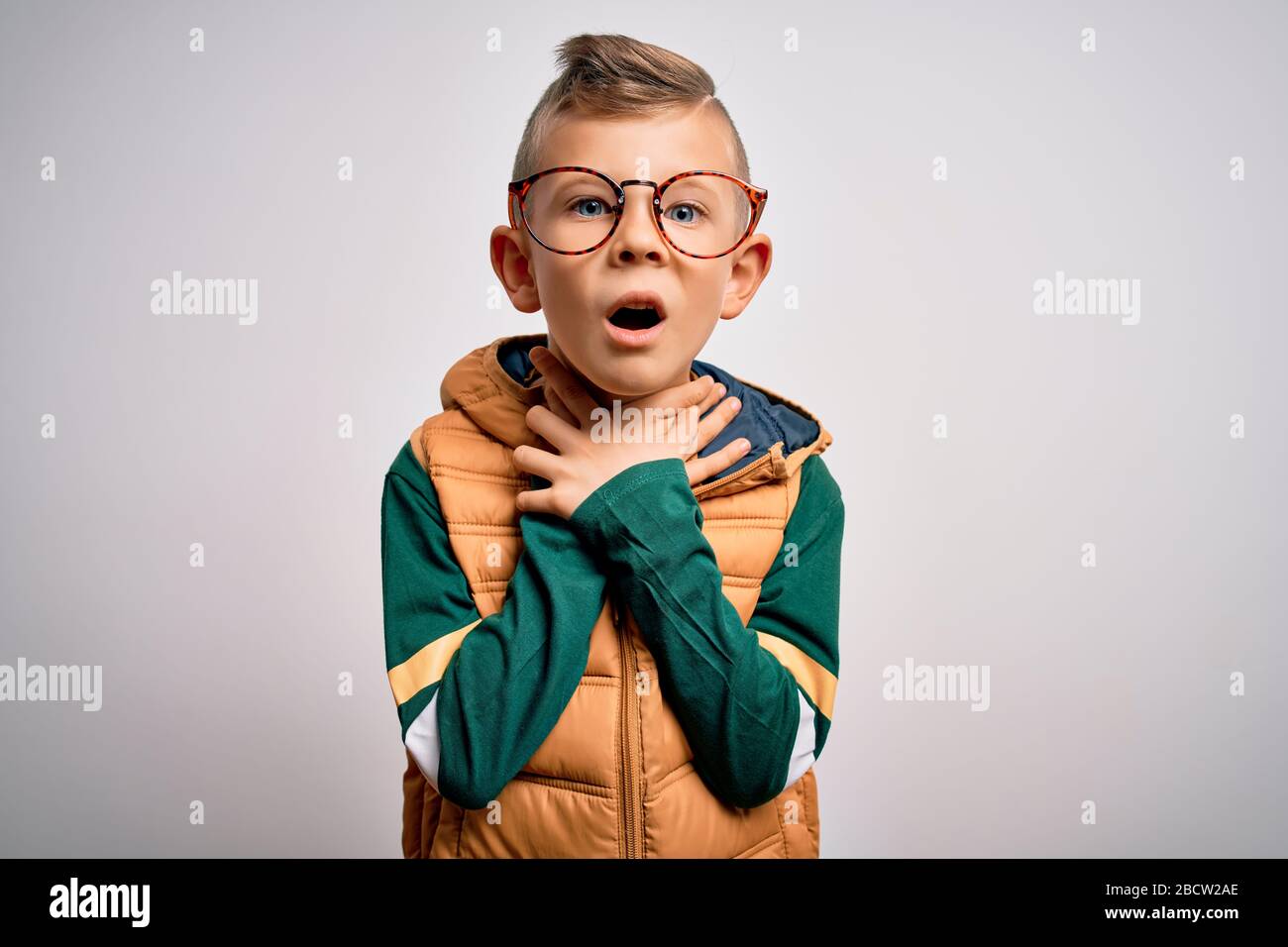 Young little caucasian kid with blue eyes wearing winter coat and smart ...