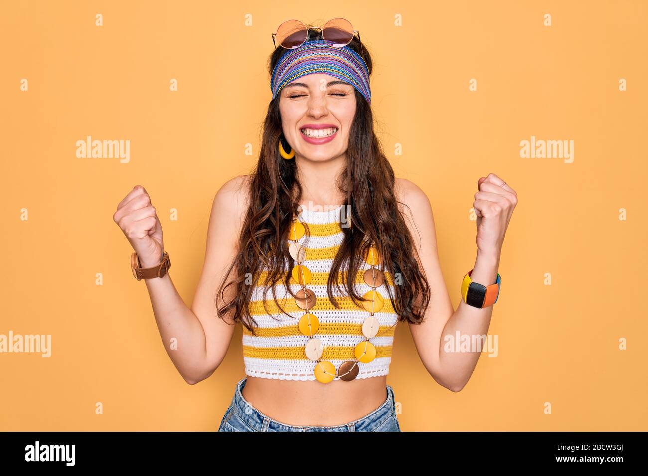 Young beautiful hippie woman with blue eyes wearing accesories and ...