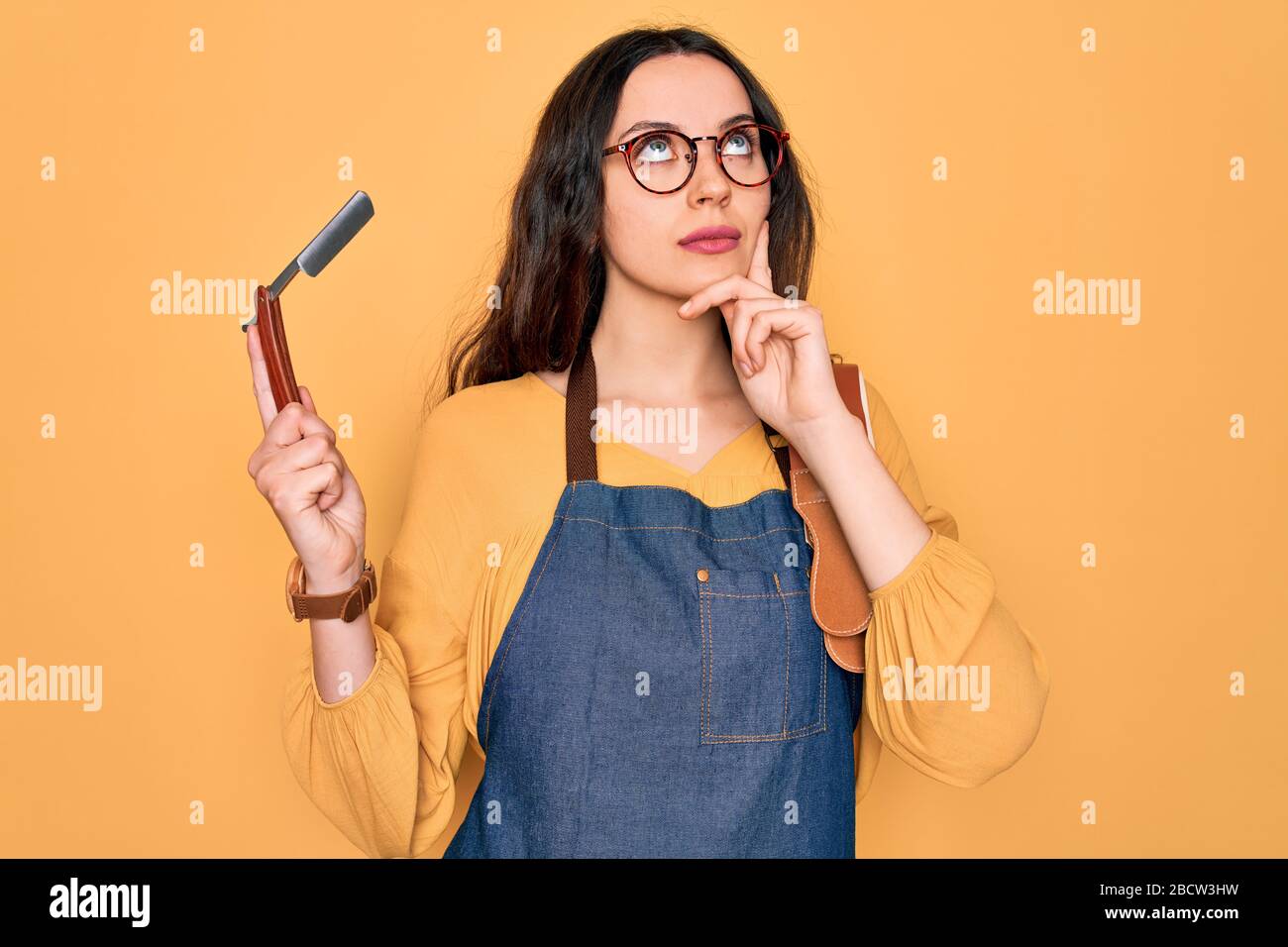 Woman holding cut razor looking hi-res stock photography and images - Alamy