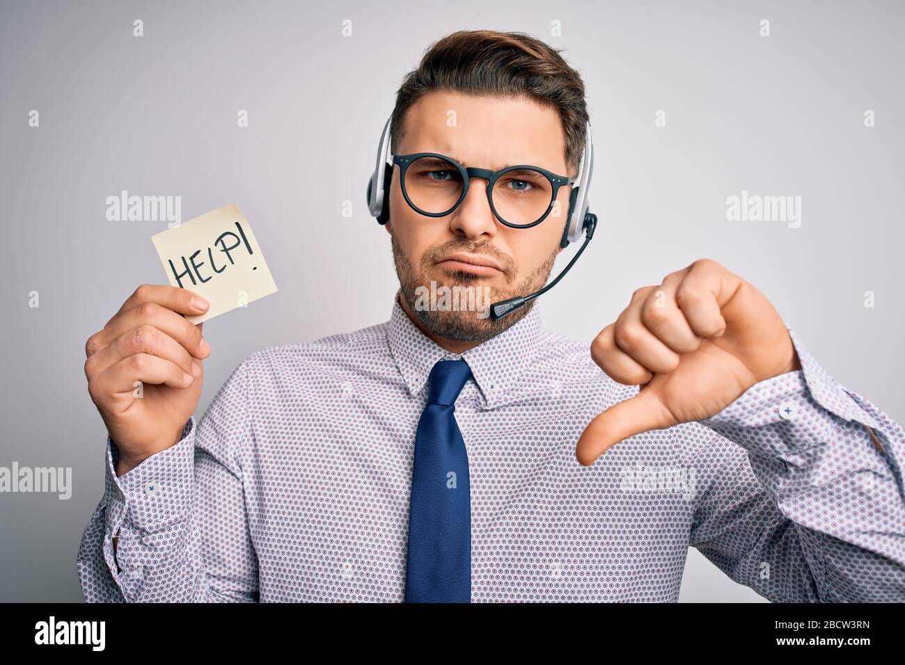 Young call center operator business man with blue eyes offering support ...