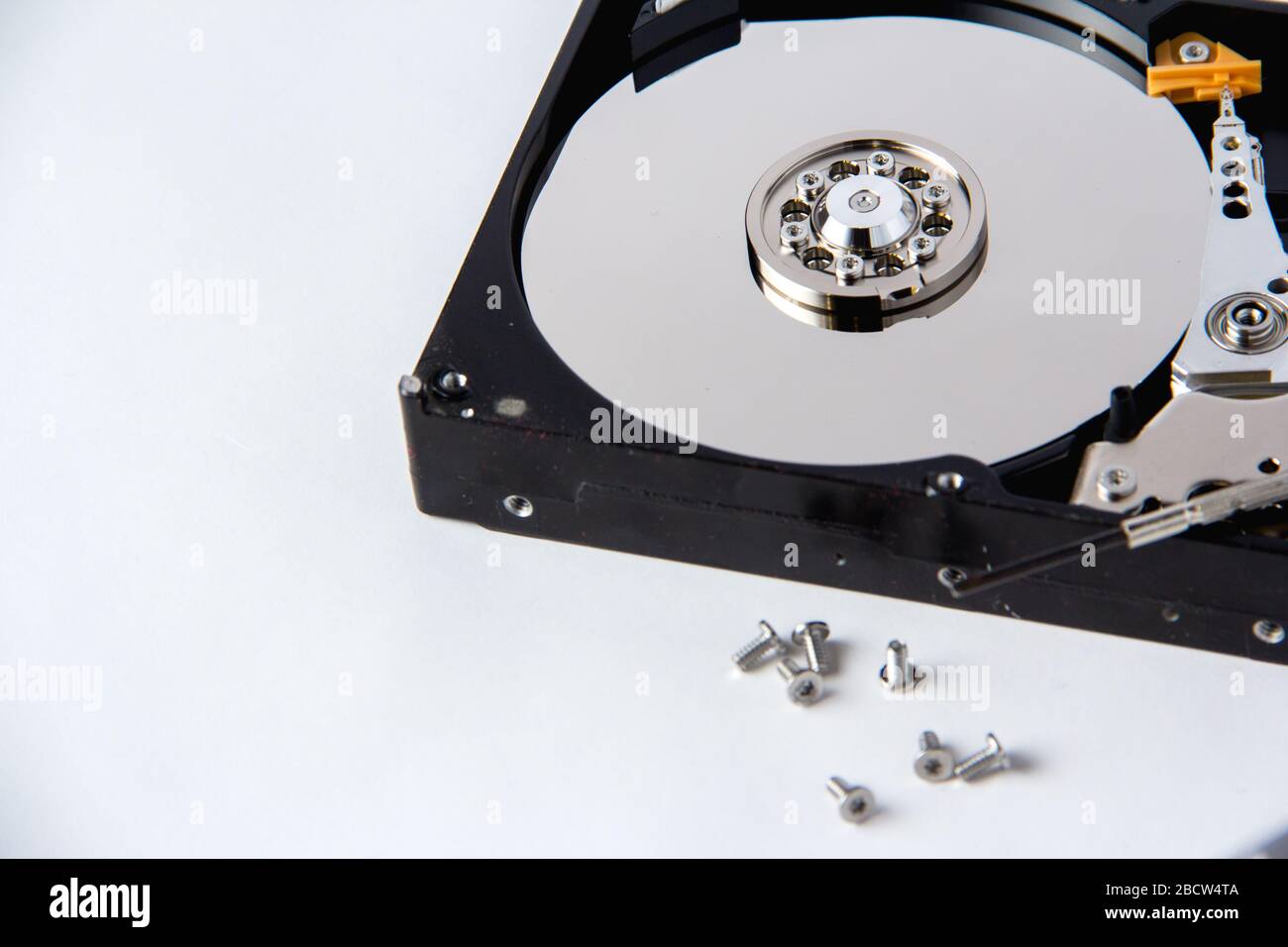 Opened computer hard drive on a white background. Data storage ...
