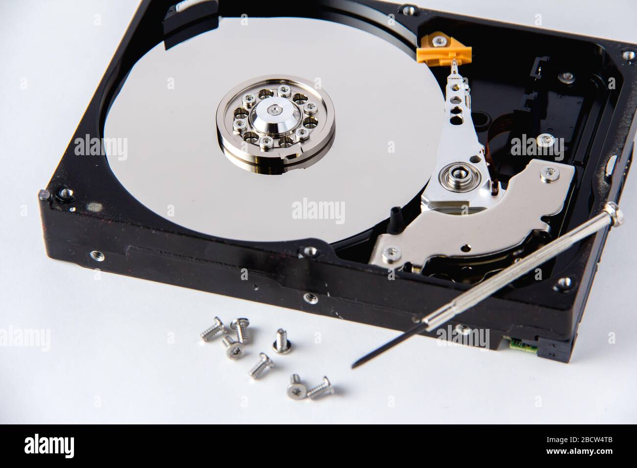 Opened computer hard drive on a white background. Data storage ...