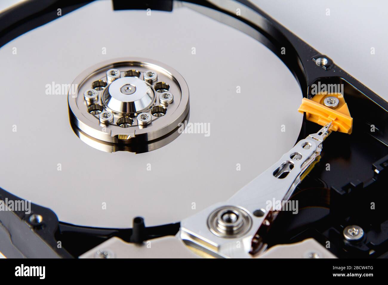 Opened computer hard drive on a white background. Data storage ...