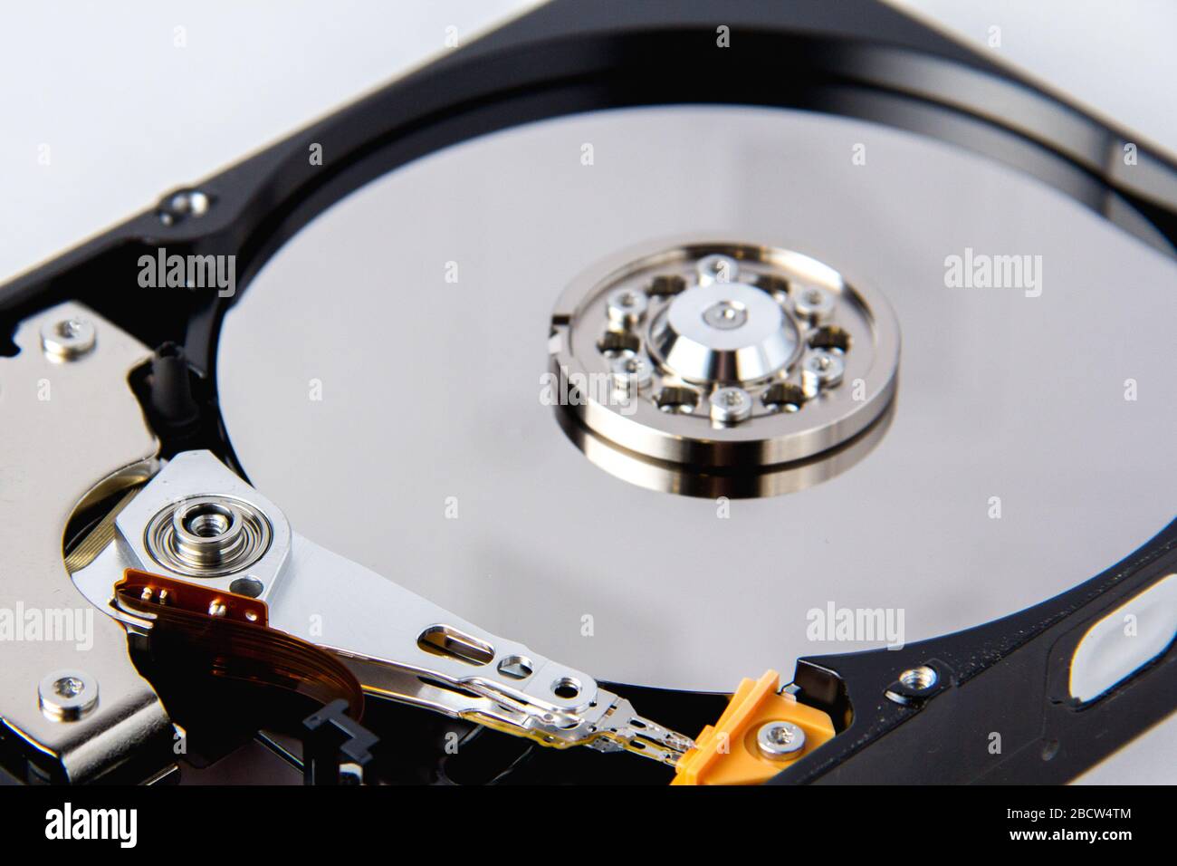 Opened computer hard drive on a white background. Data storage ...