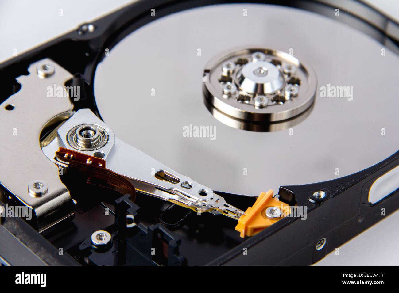 Opened computer hard drive on a white background. Data storage ...
