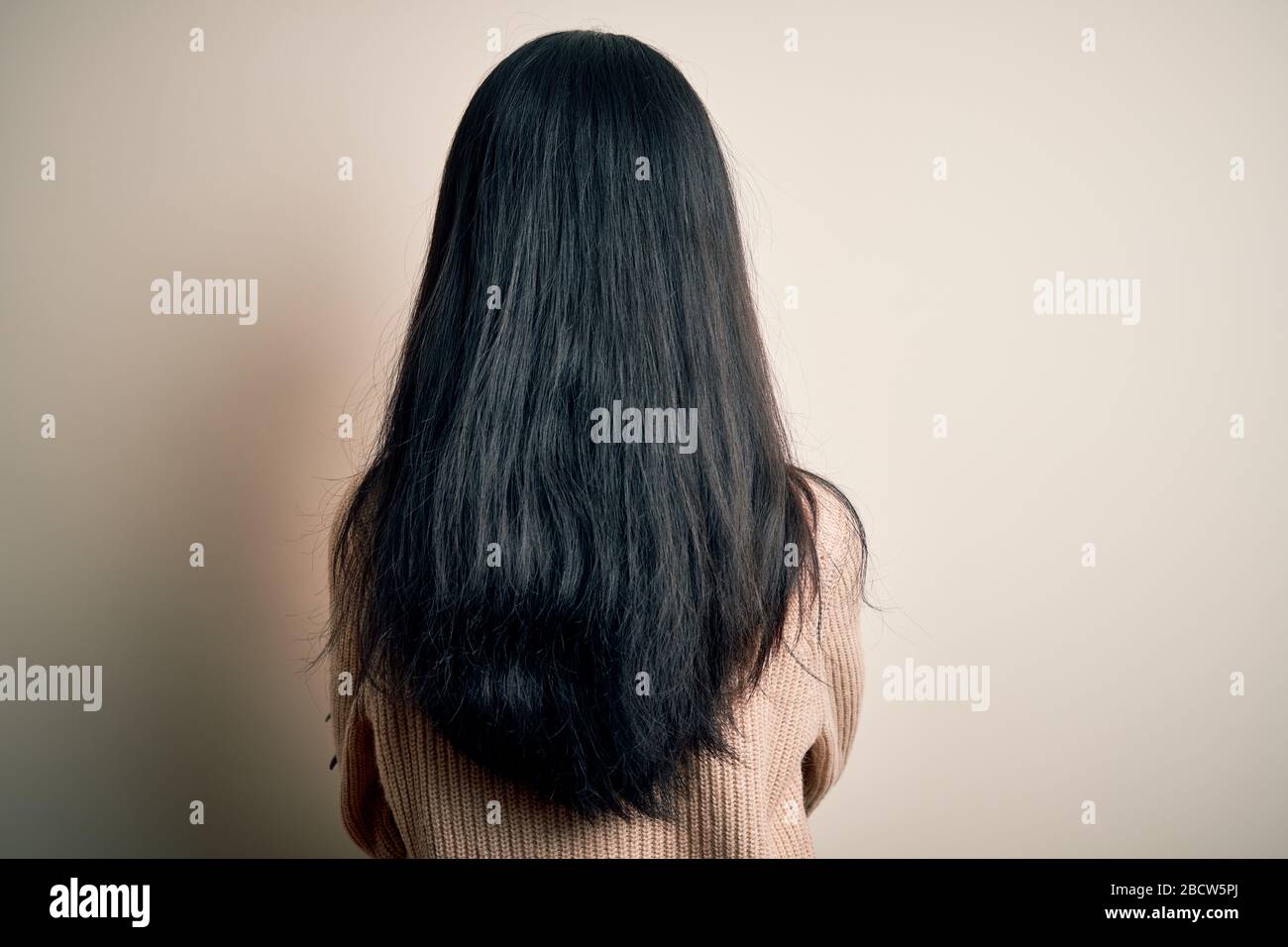 Young beautiful chinese woman wearing casual sweater over isolated ...