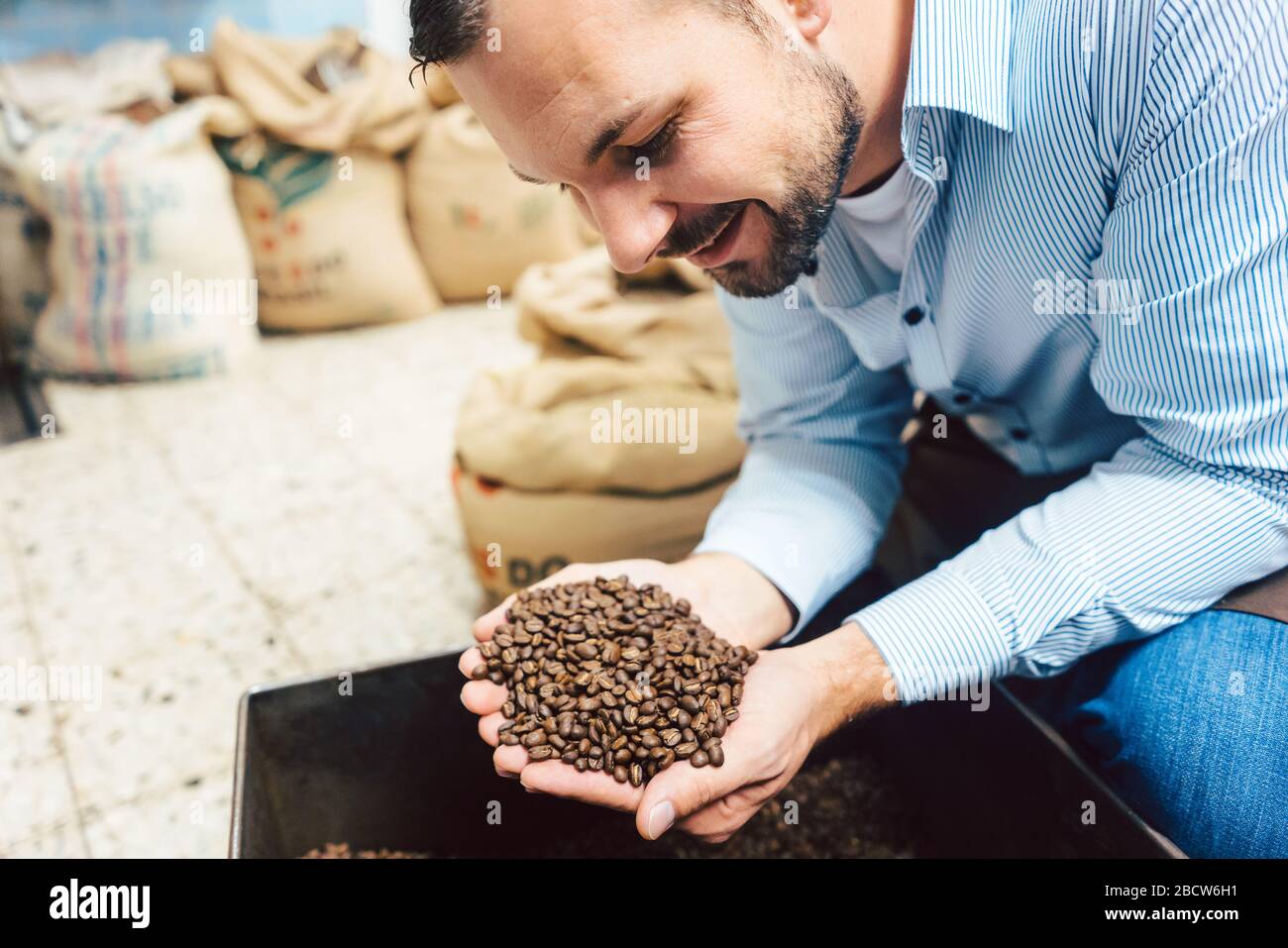 Man roasting coffee hi-res stock photography and images - Alamy