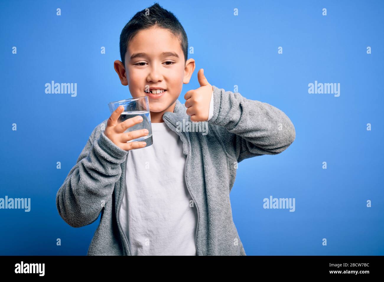 Adorable toddler smiling happy and confident. Standing with smile on ...