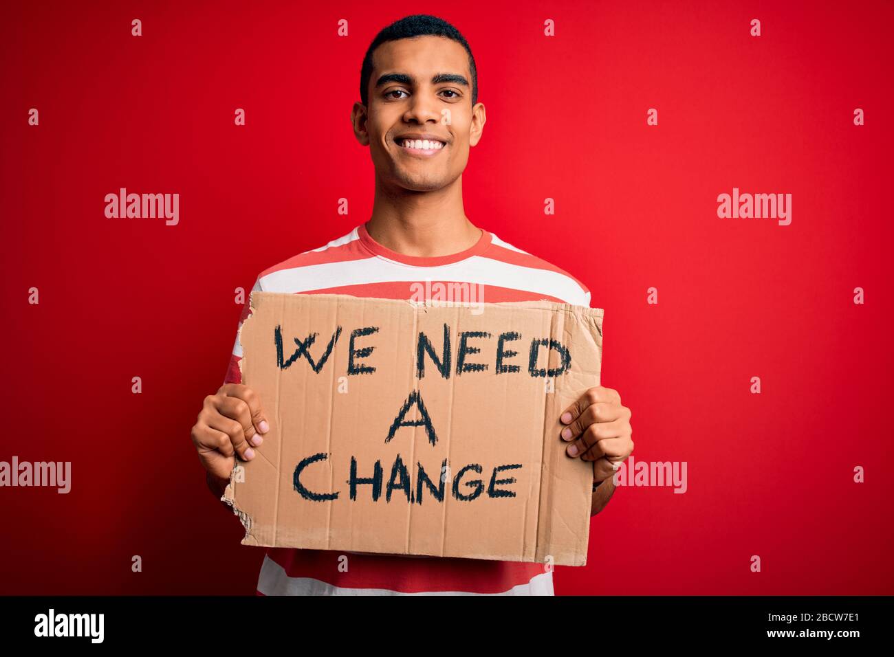 Young handsome african american activist man asking for change holding ...