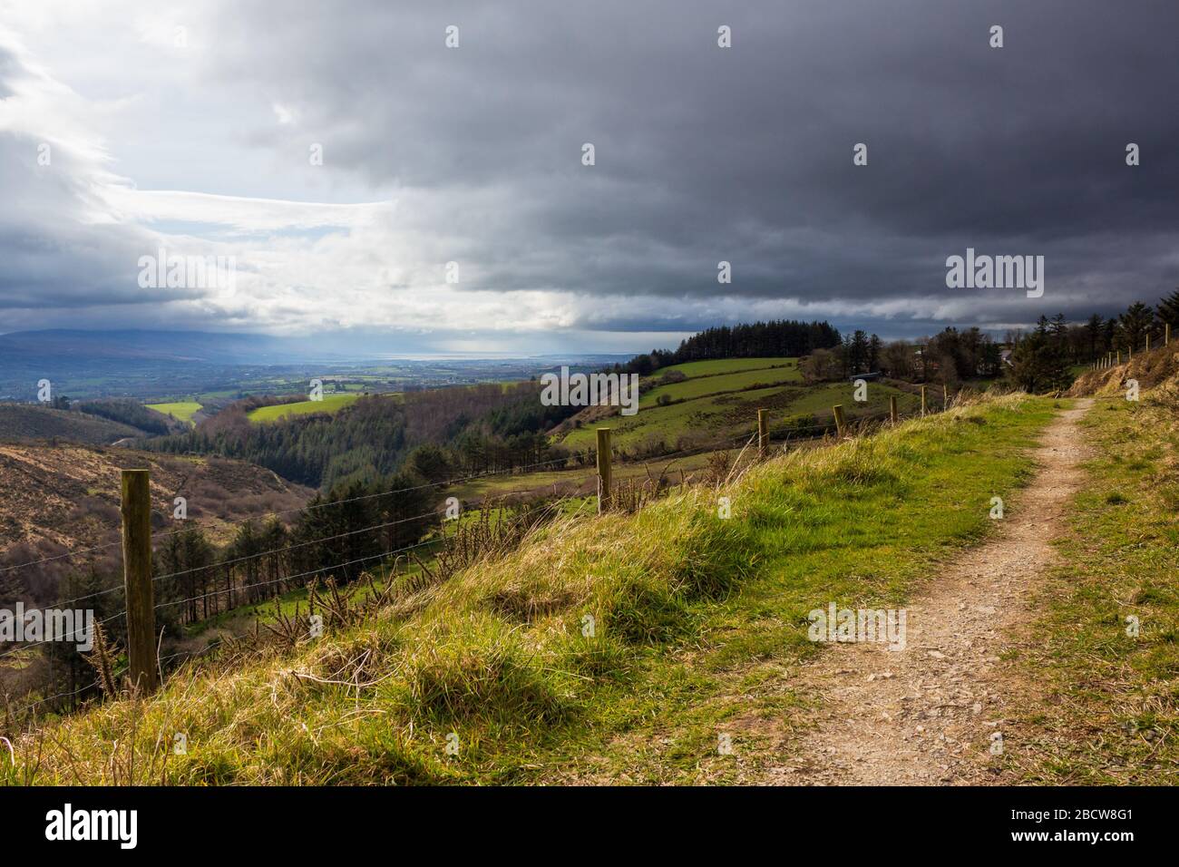 Countryside trail under dark clouds in County Kerry, Ireland Stock ...