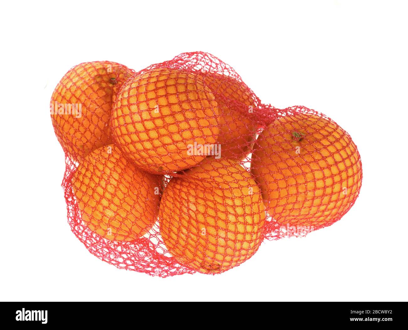 Orange in red net isolated on white background. Fresh oranges in ...