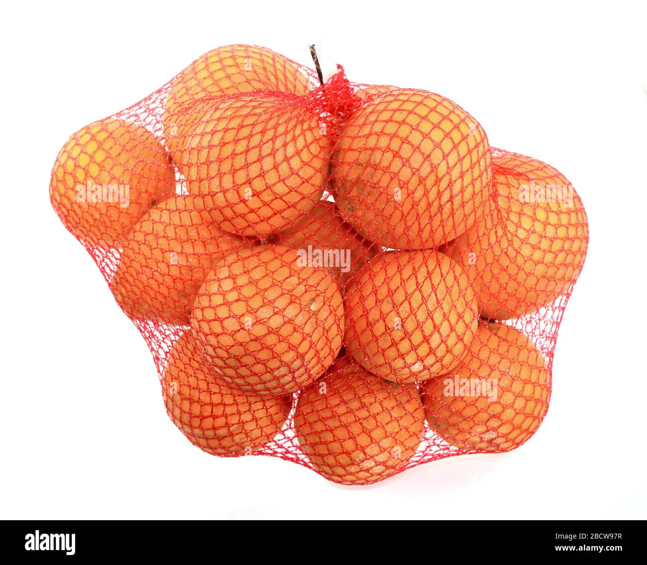 Orange in red net isolated on white background. Fresh oranges in ...