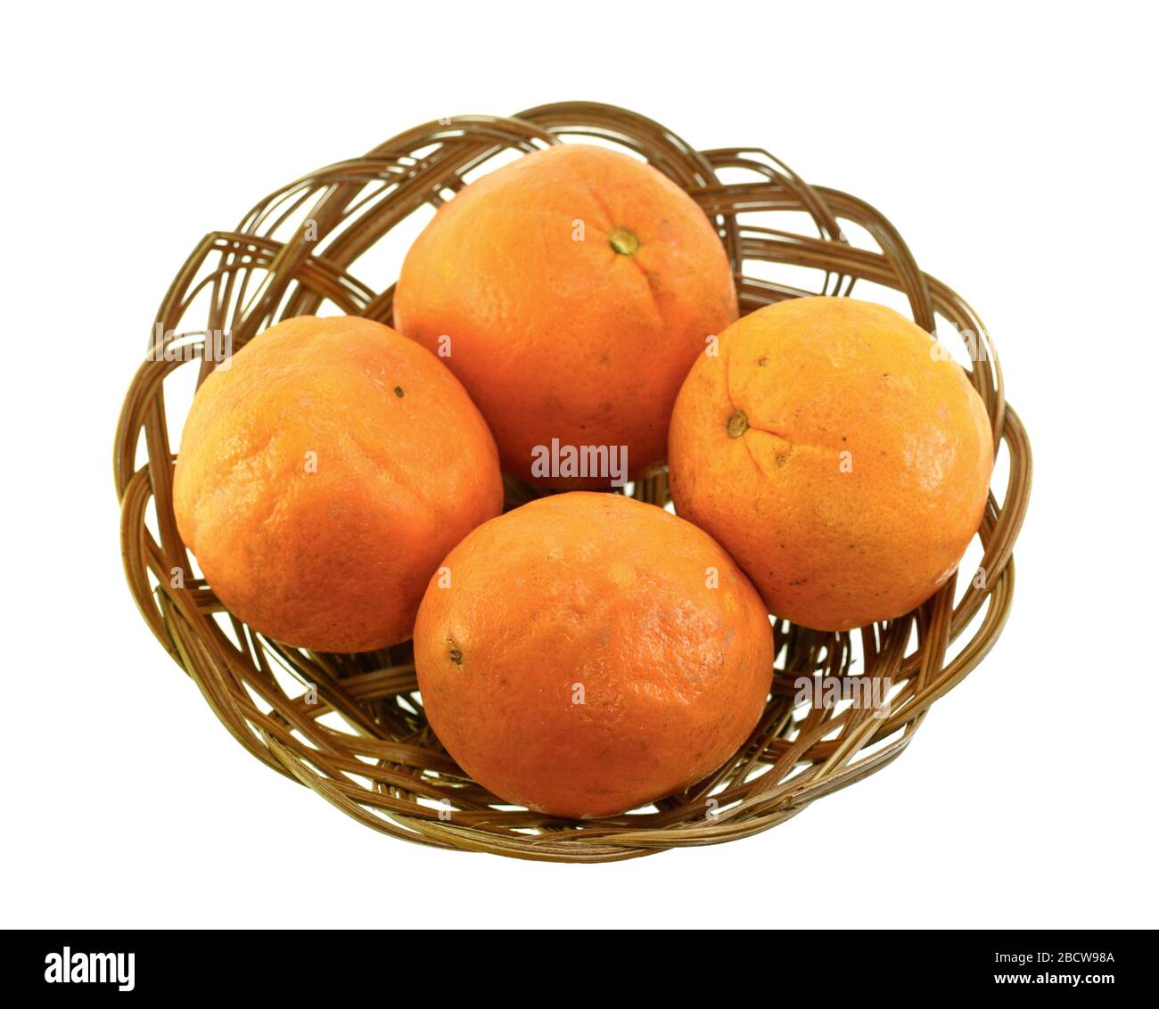 Orange in basket on white background Stock Photo - Alamy