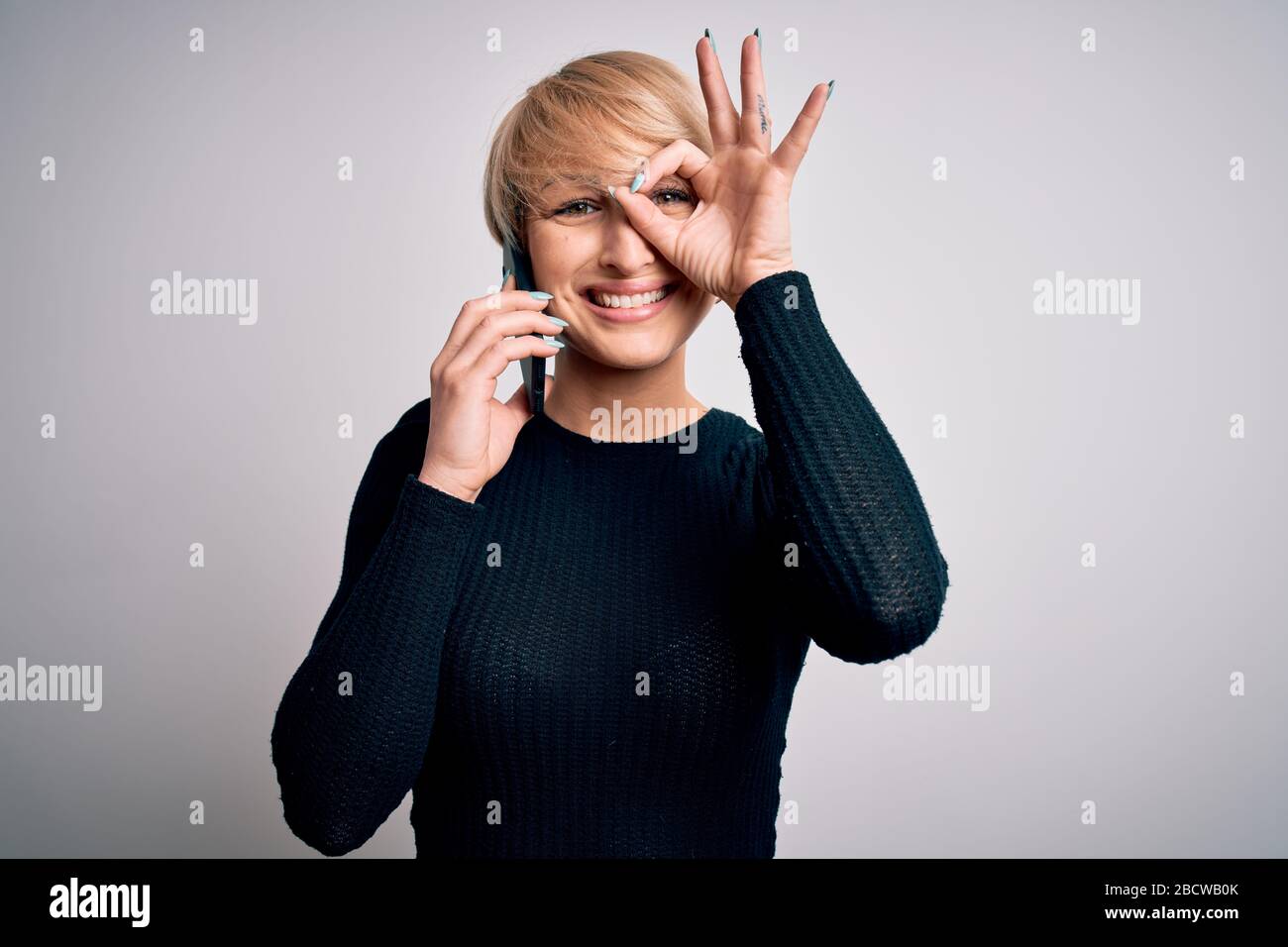 Young blonde woman with short hair having a conversation talking on ...