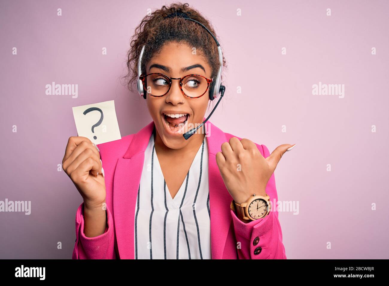 African american call center agent girl working using headset holding ...