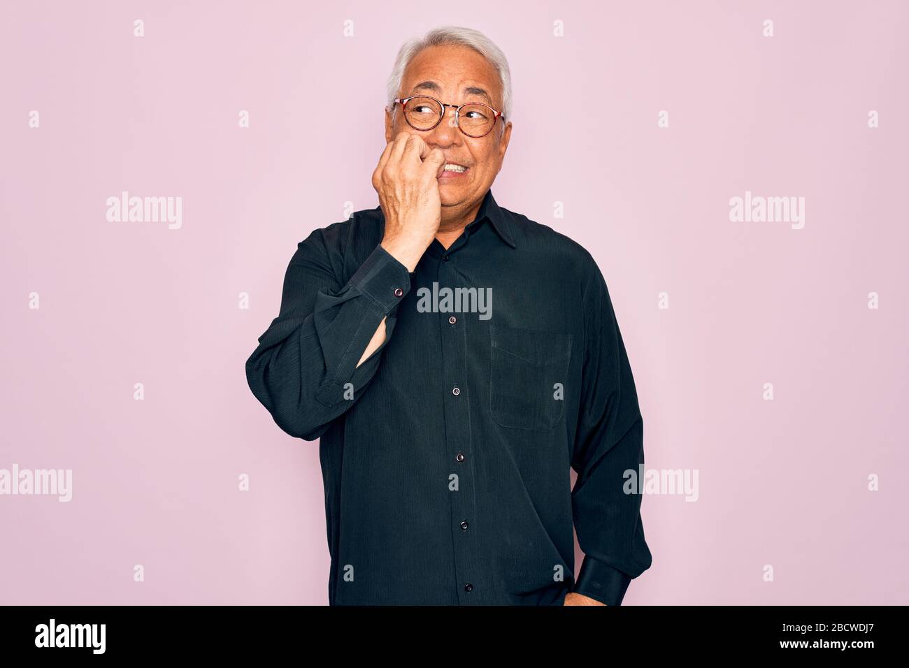 Middle age senior grey-haired handsome man wearing glasses and elegant ...