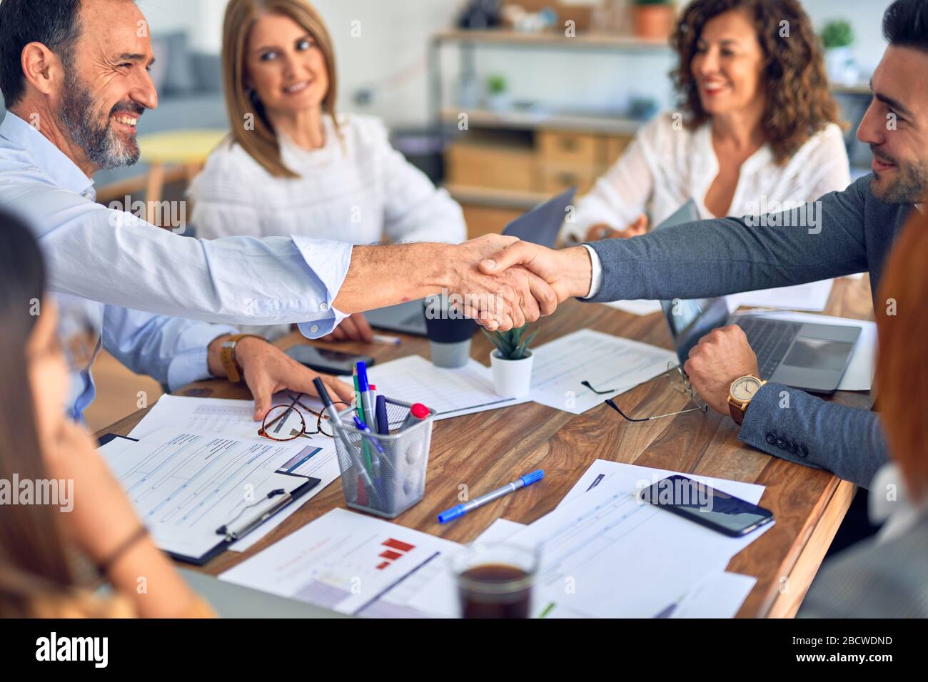 Group of business workers smiling happy and confident. Working together ...