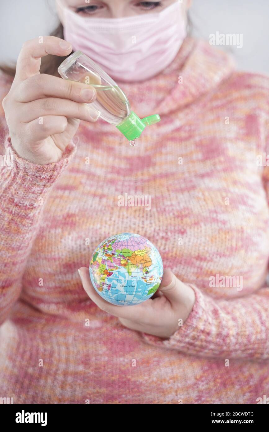 Person clean all planet, holding world globe. Hand of woman that ...