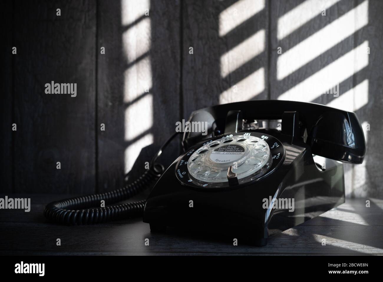 Black retro telephone with abstract graphic shadow - Still life Stock ...