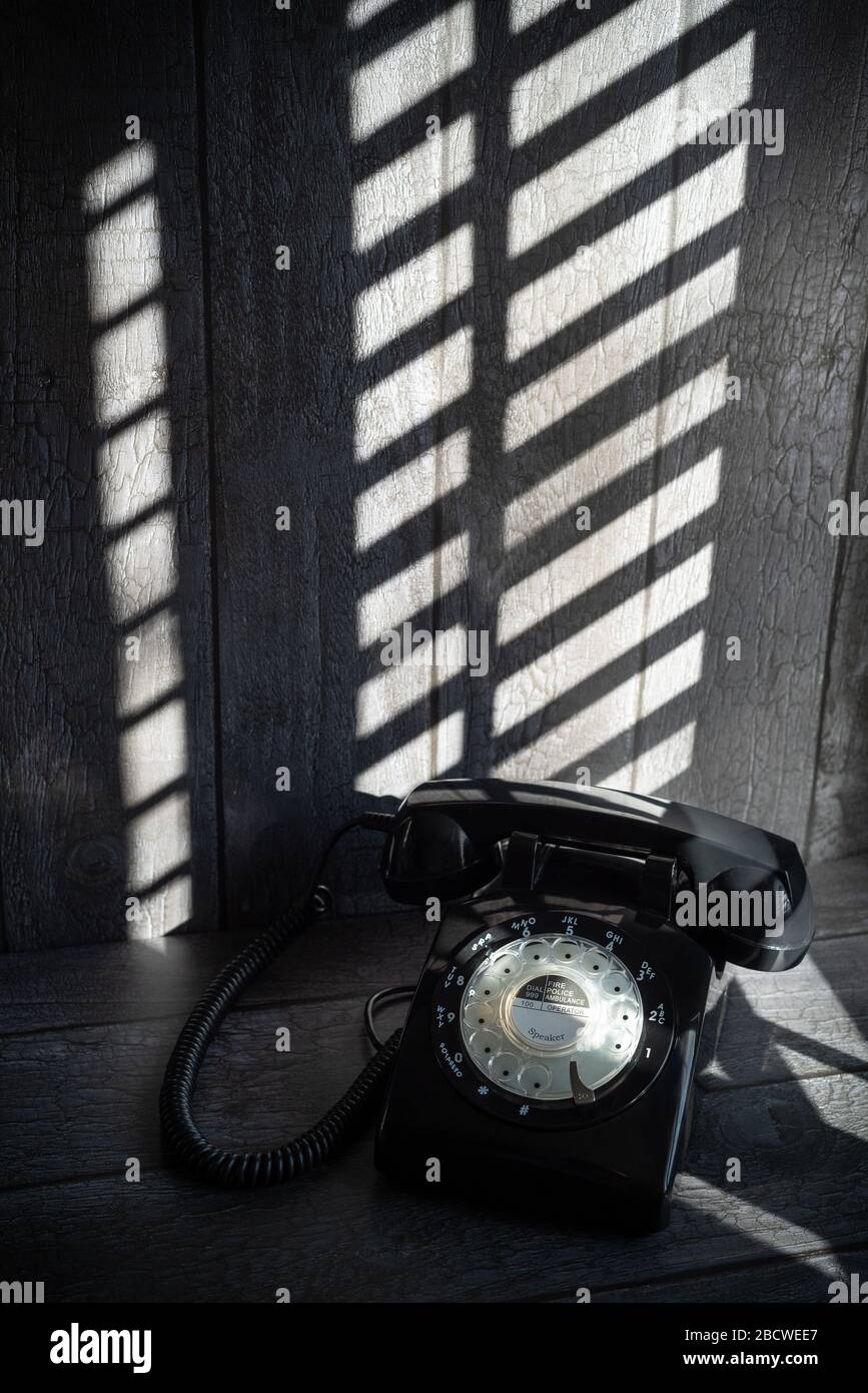 Black retro telephone with abstract graphic shadow - Still life Stock ...