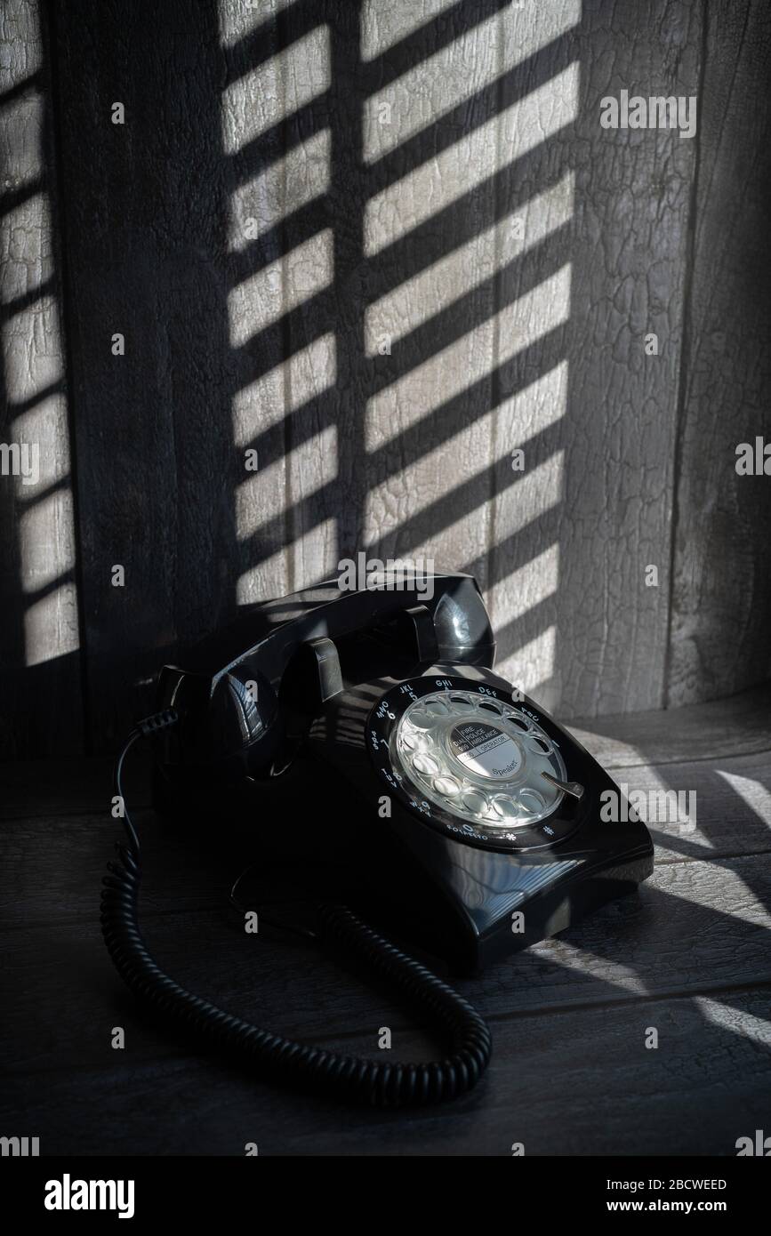 Black retro telephone with abstract graphic shadow - Still life Stock ...