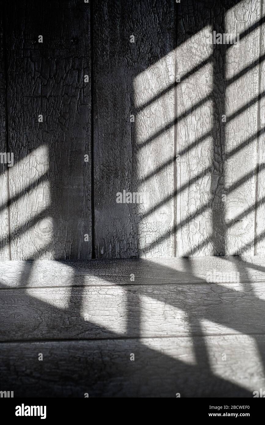 Graphic abstract shadow lines on dark wooden surface Stock Photo - Alamy