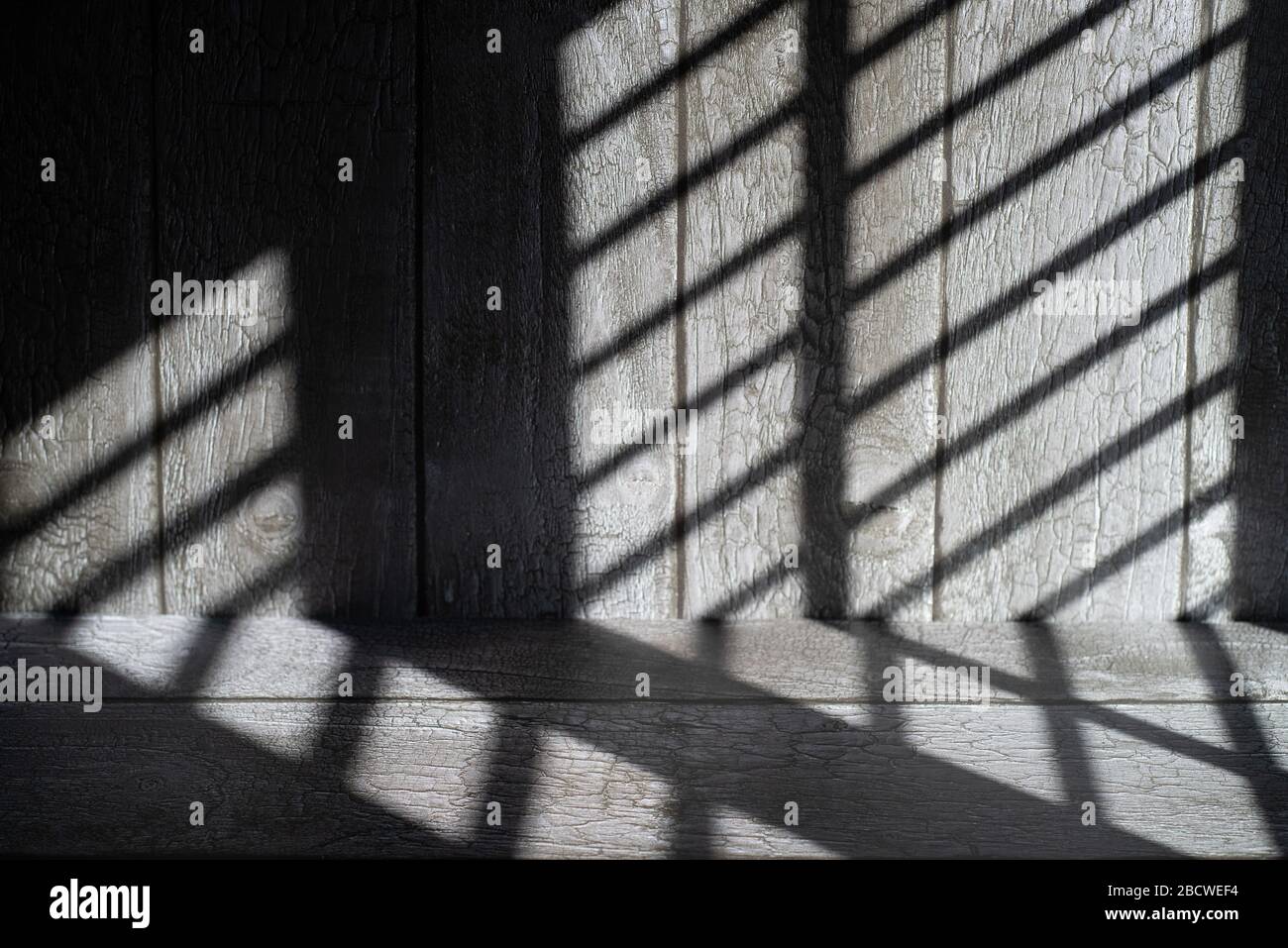 Graphic abstract shadow lines on dark wooden surface Stock Photo - Alamy