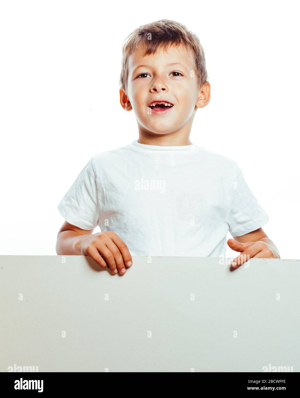 young pretty little boy wondering face gesturing, pointing isolated on ...