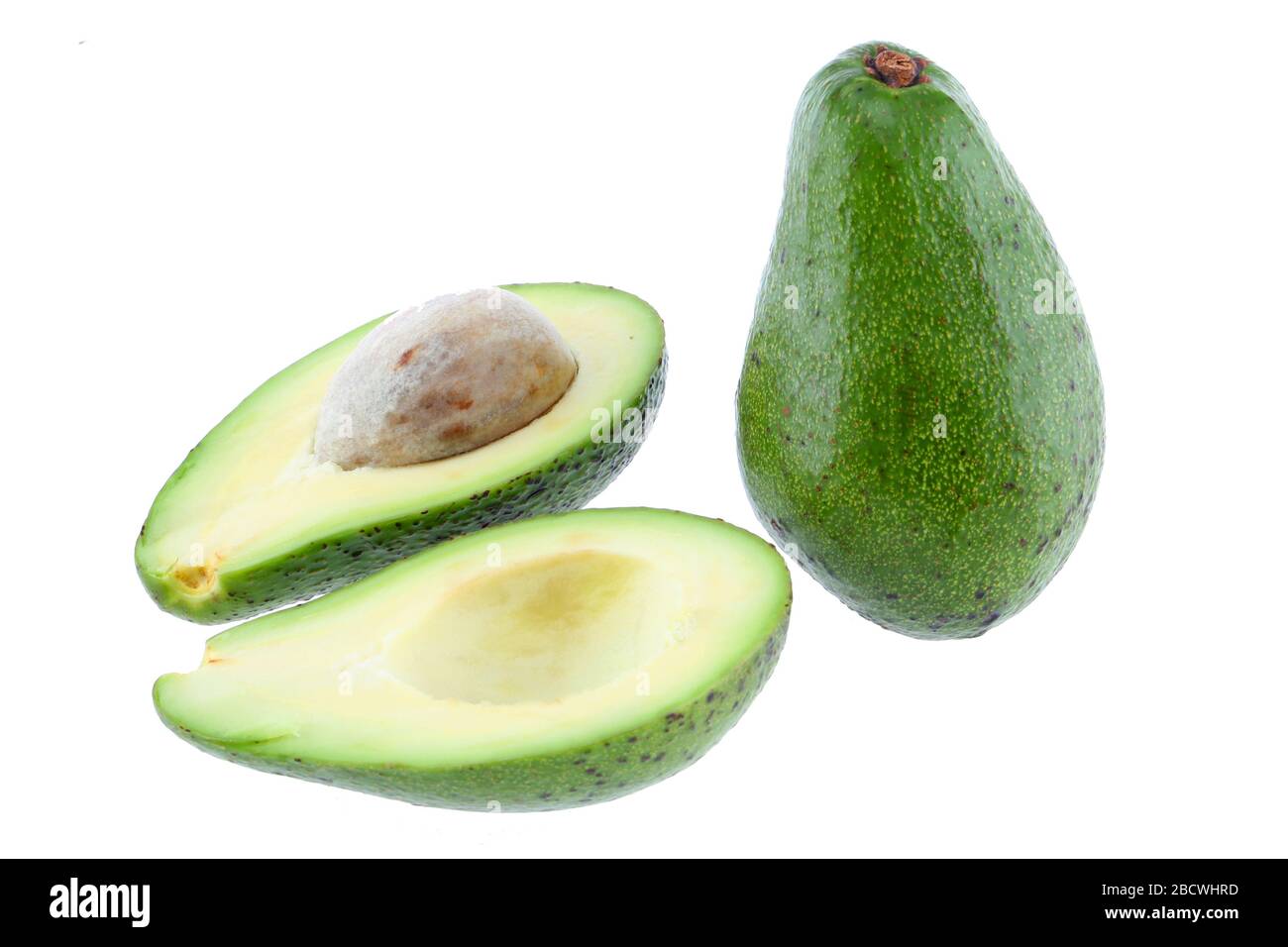 Avocado half cut isolated on white Clipping Path. Professional food ...
