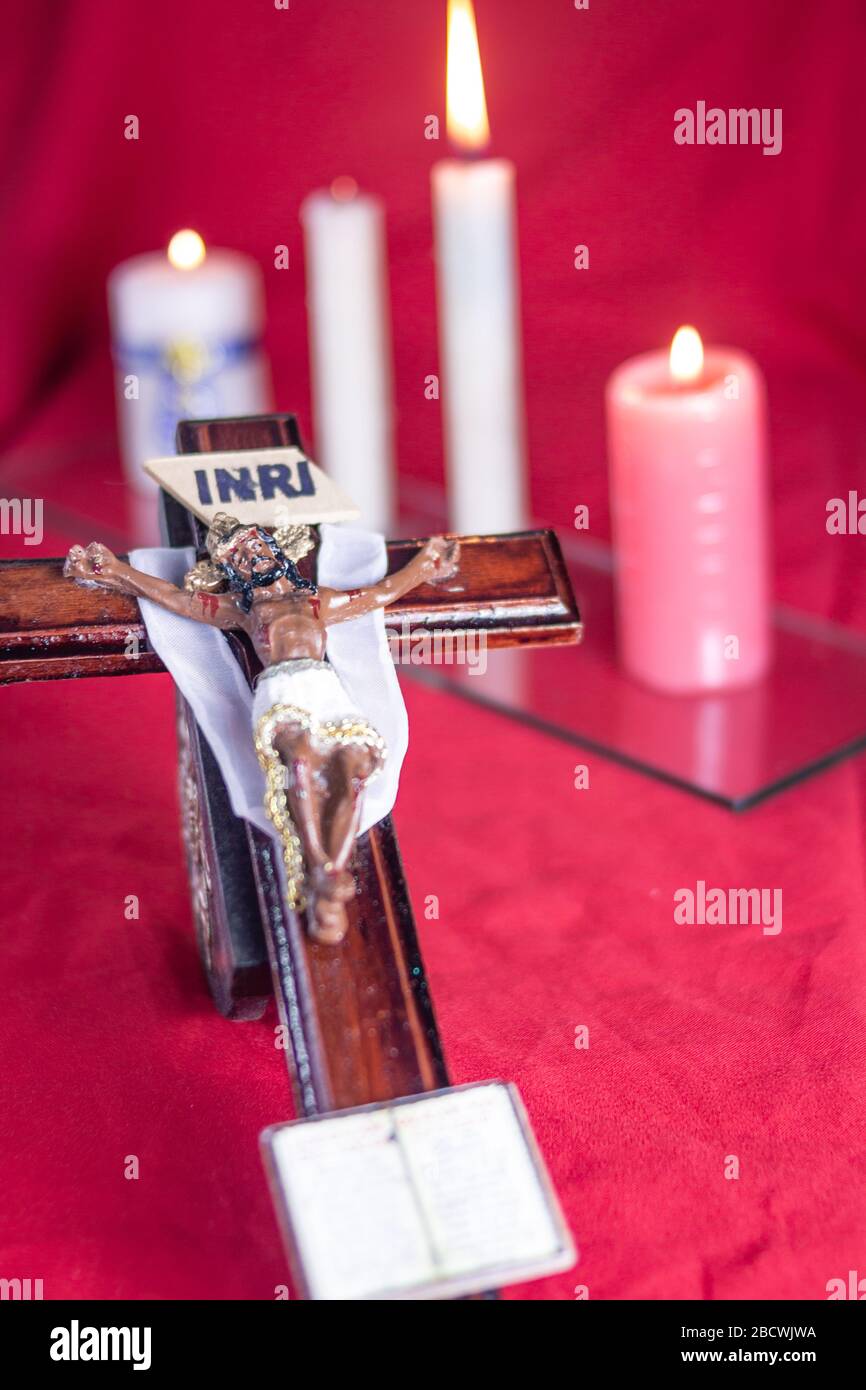 christ jesus holy week with candles behind and red tablecloth 2 Stock ...