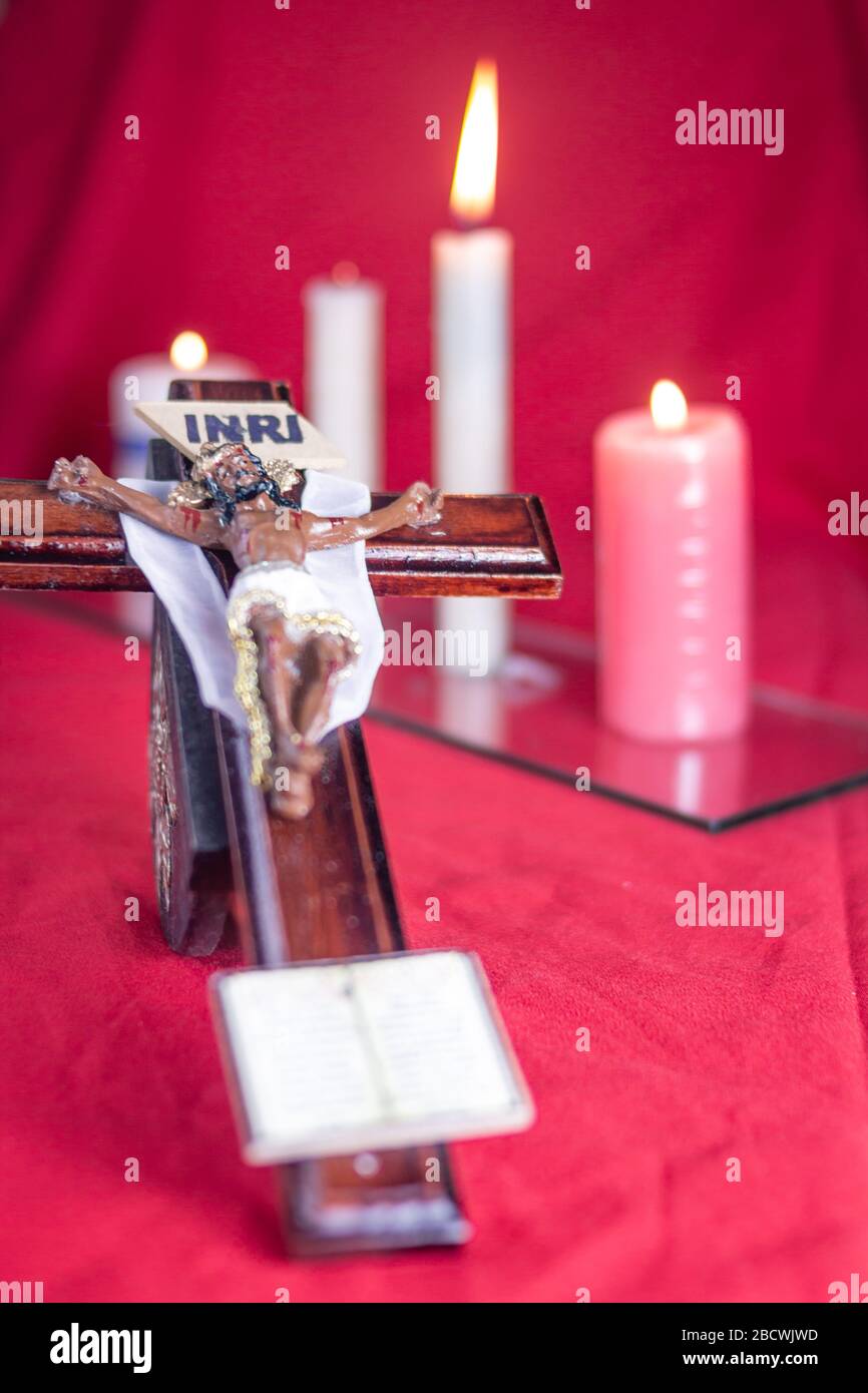 christ jesus holy week with candles behind and red tablecloth 3 Stock ...