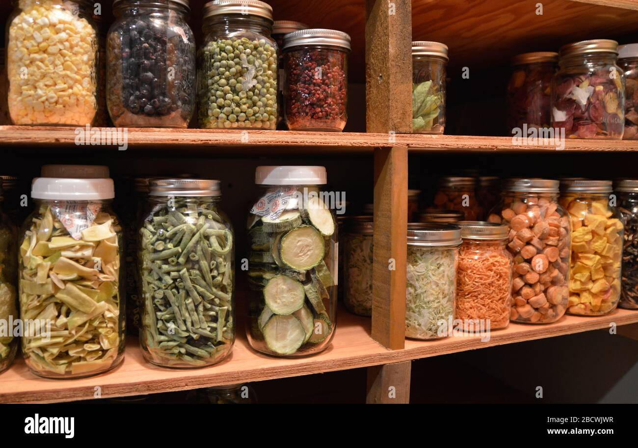 color picture of food reserves on a shelf in transparent jars, dried ...