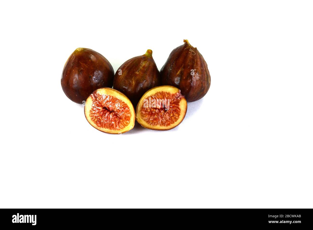 fresh figs and cut figs isolated on white background Stock Photo - Alamy