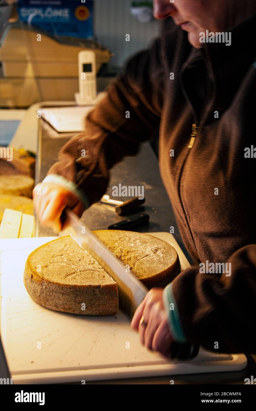 Cutting cheese wheel hi-res stock photography and images - Alamy