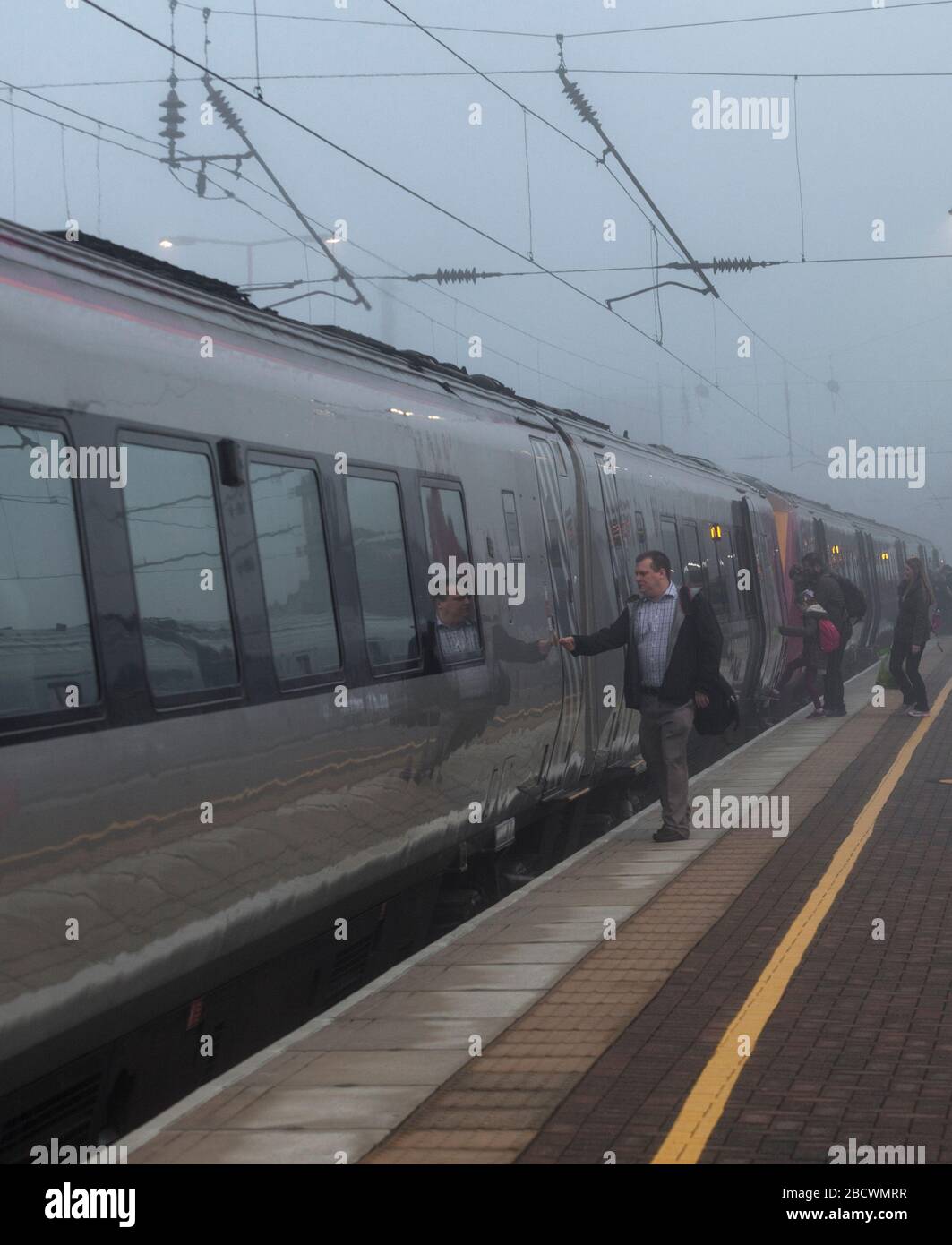Railway passengers joining a Virgin Train at Wigan North Western ...