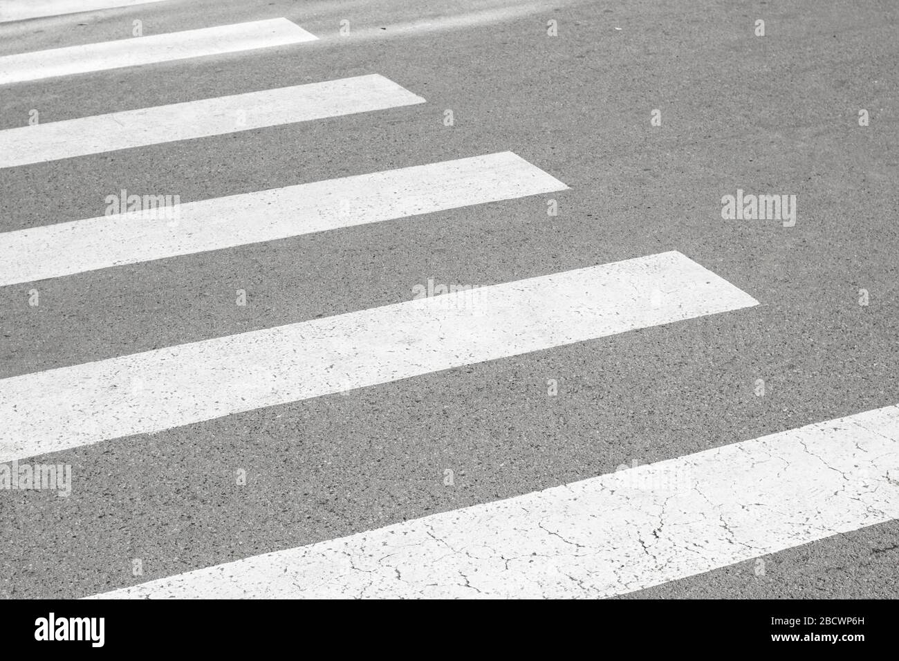 Zebra crossing painted on the asphalt, detail of a signal circulation ...