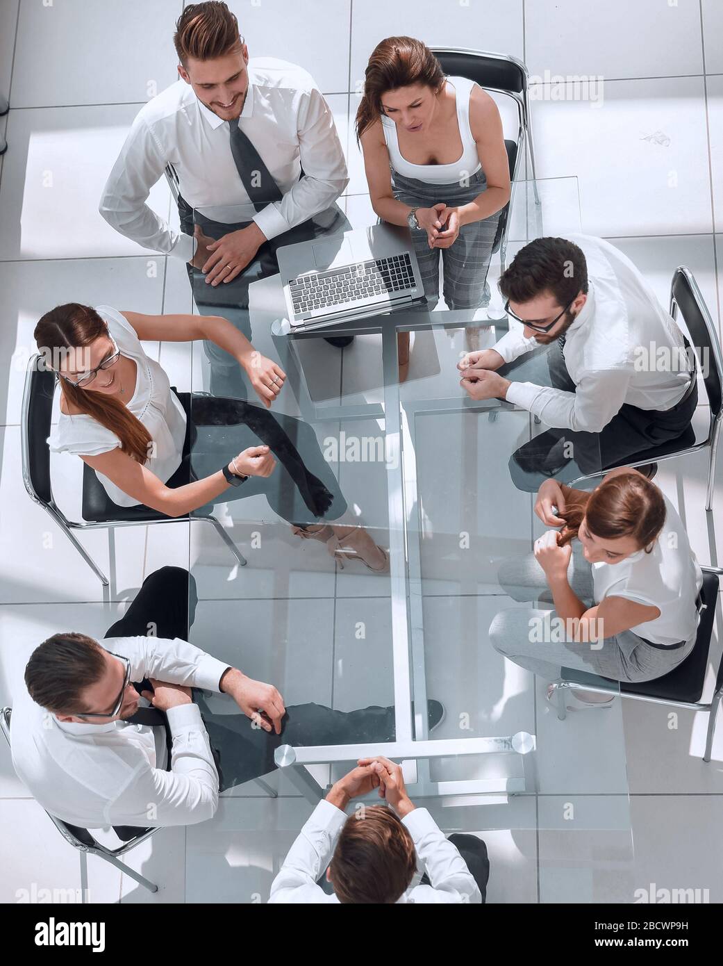 top view.business team sitting at the office table Stock Photo - Alamy