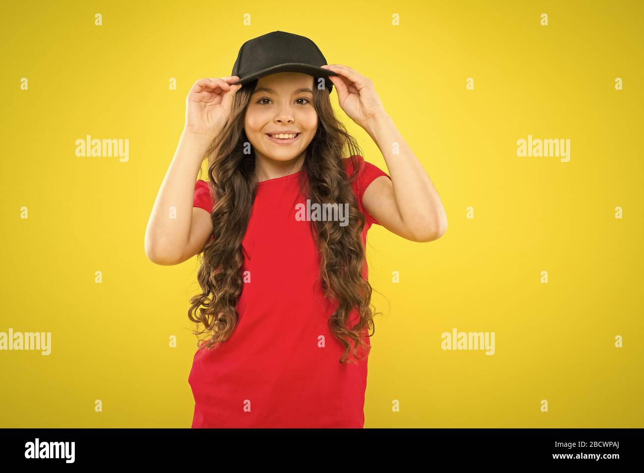 Cute child wear cap or snapback hat. Little girl wearing baseball cap ...