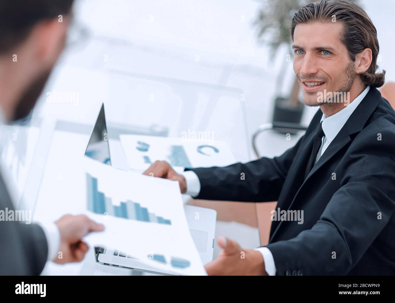 employee gives the Manager the financial report Stock Photo - Alamy