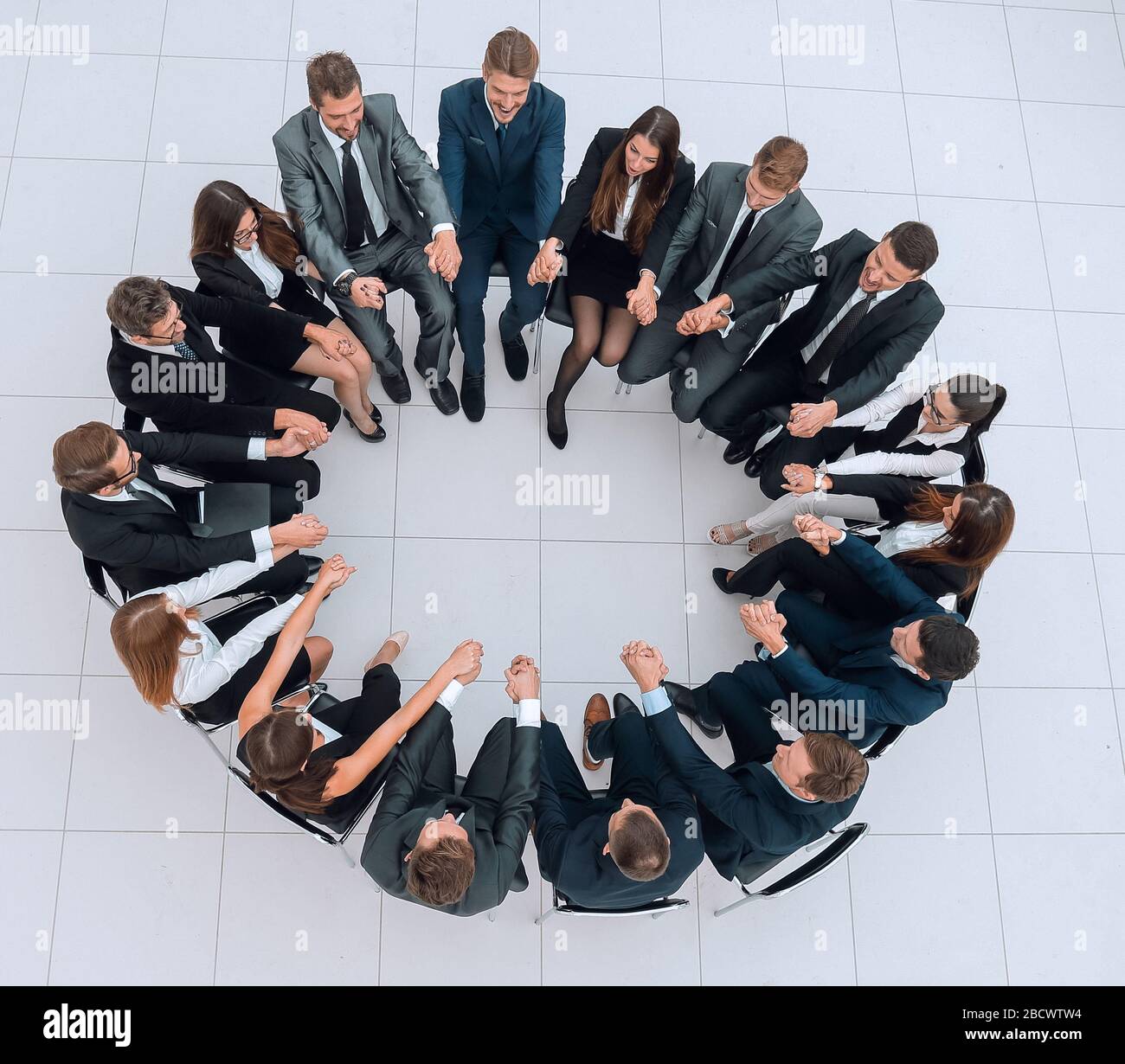 concept of team building.large business team sitting in a circle Stock ...